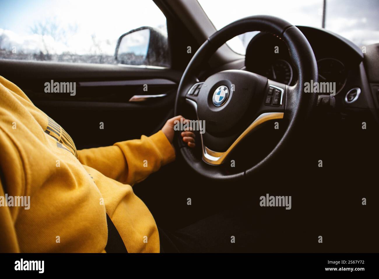 Kyiv, Ukraine May 1, 2022 Cropped photo of a faceless female driver ...