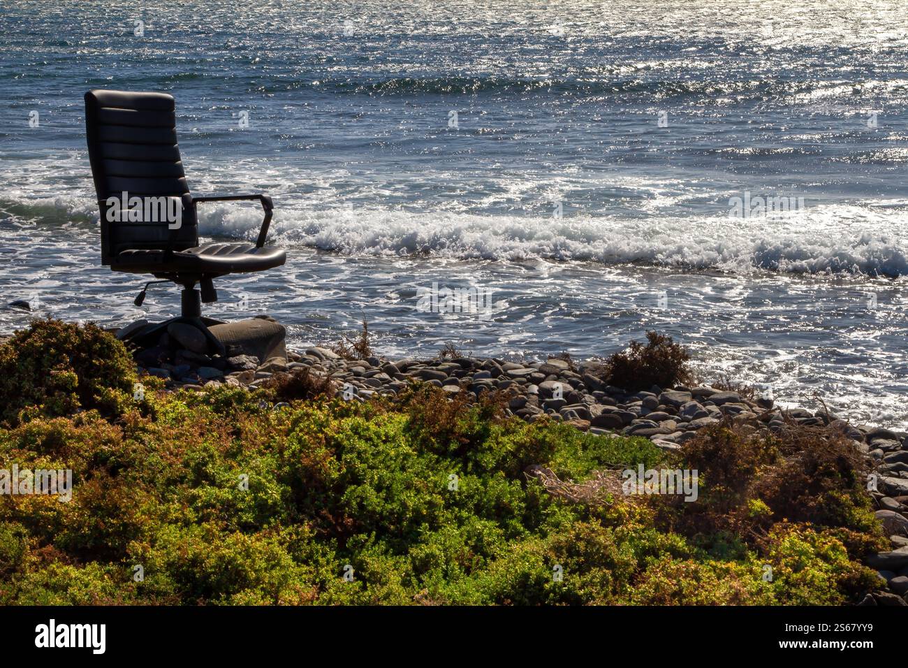 An Empty executive chair by the sea, representing solitude, inspiration ...