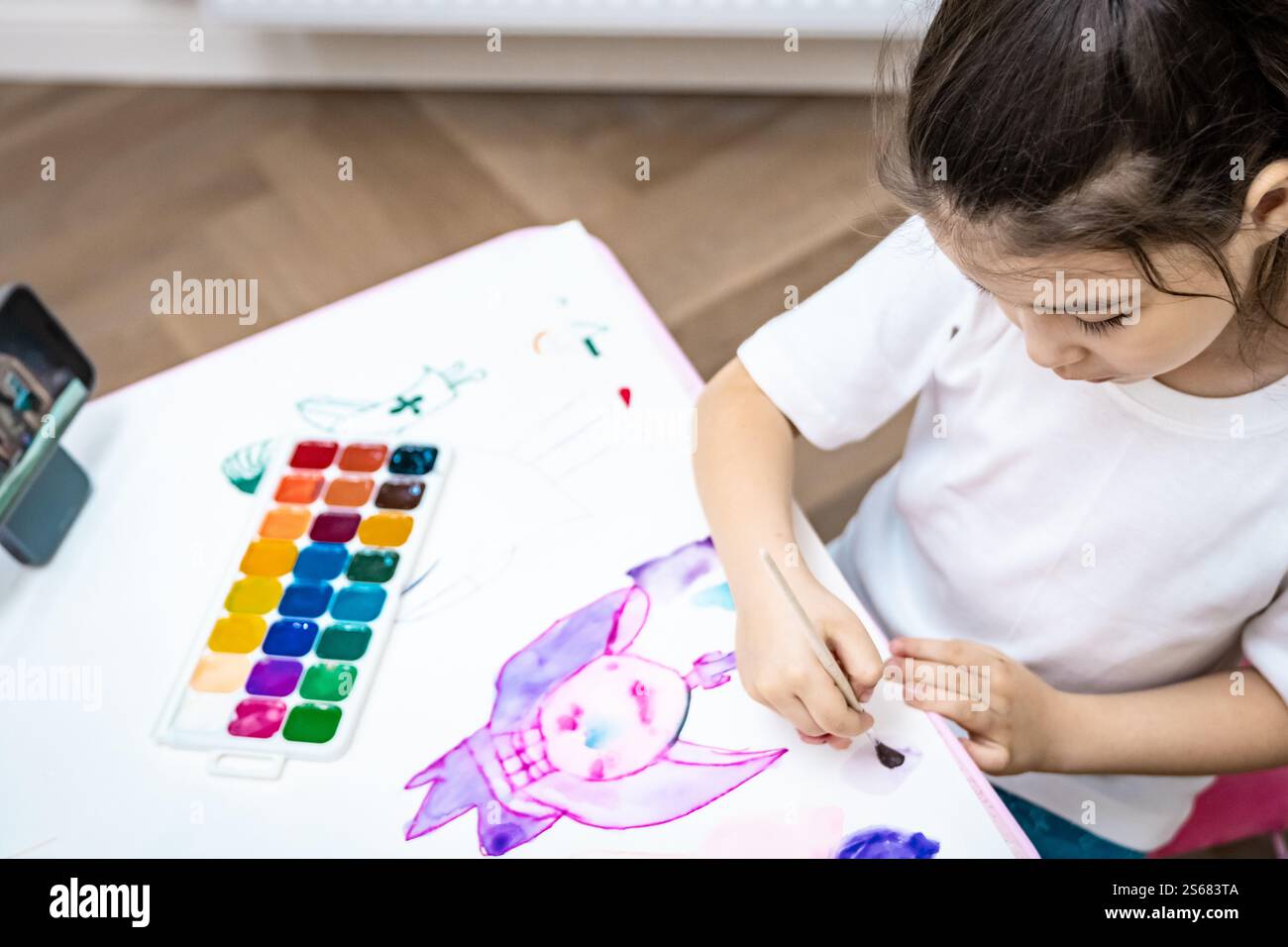child painting a picture with school supplies, preschool child painting ...
