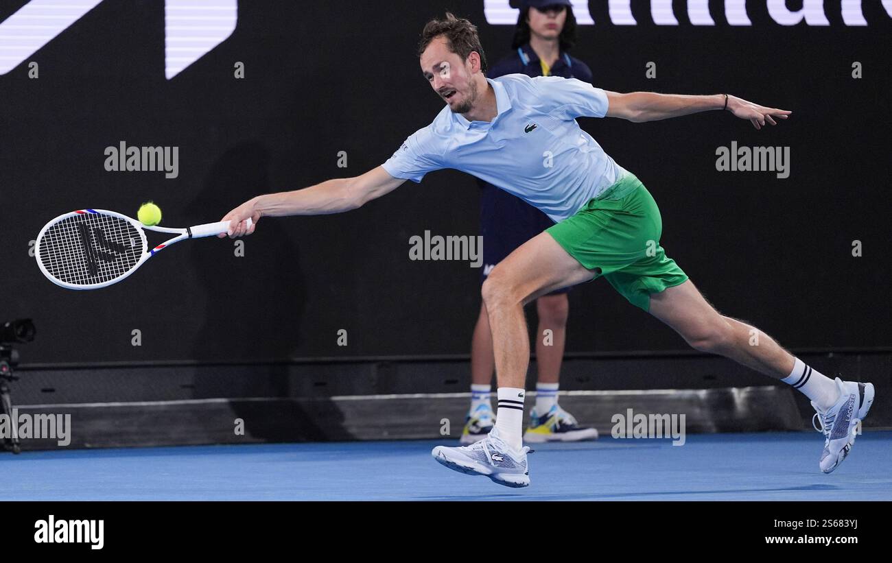 Daniil Medvedev of Russia plays a forehand return to Learner Tien of ...