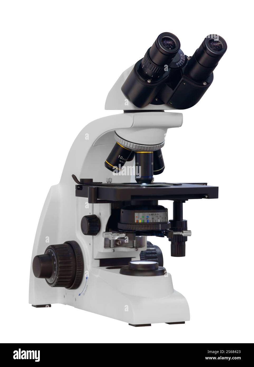 A microscope with a white base and black and yellow lenses. The ...