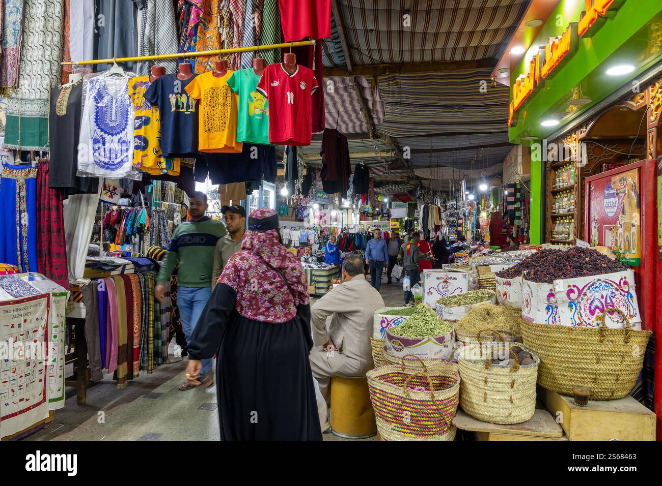 Vendors and people shopping at the egyptian market (souk) of Aswan ...