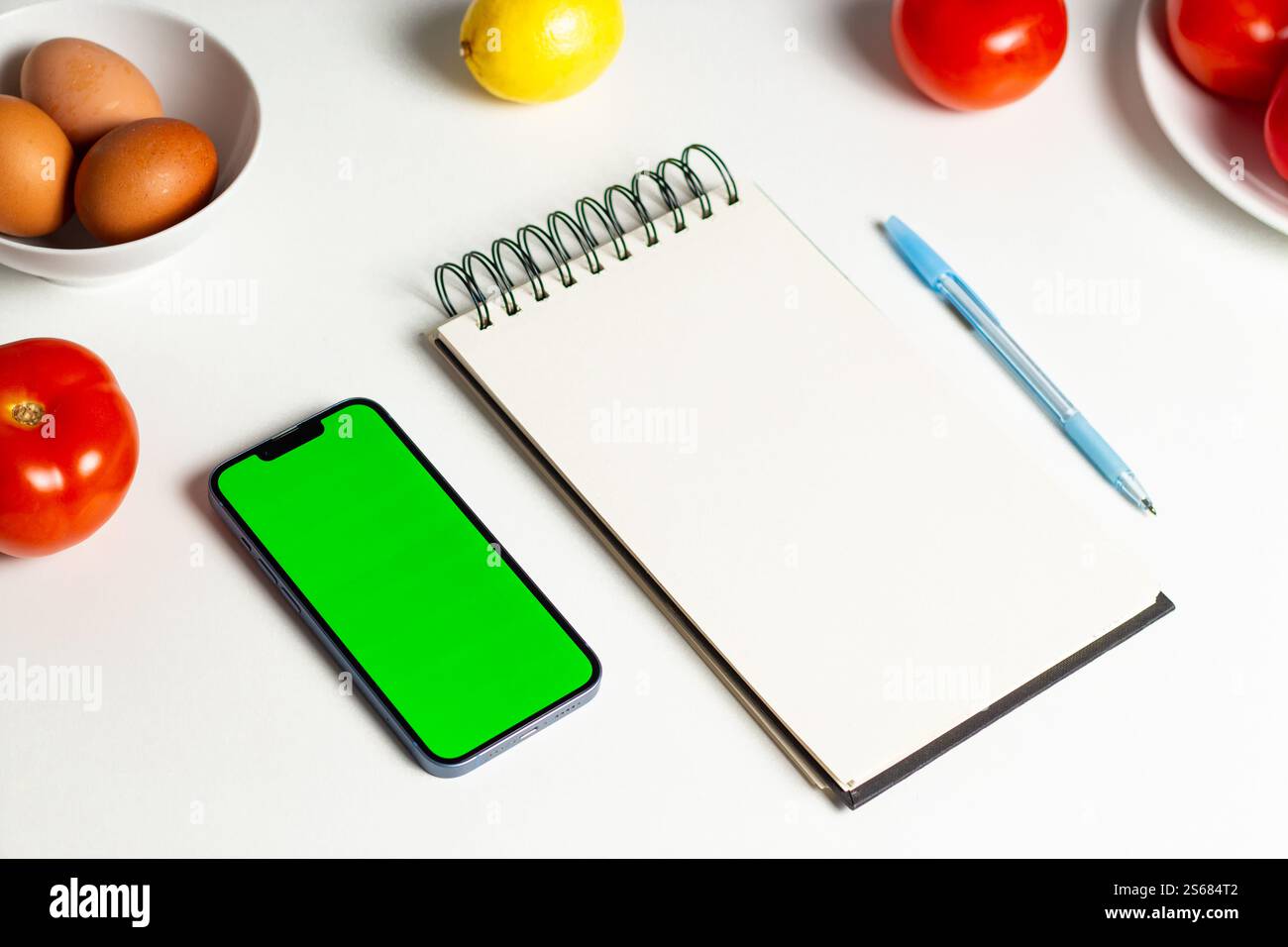 Overhead shot of female creating diet plan for weight loss. Mock up ...
