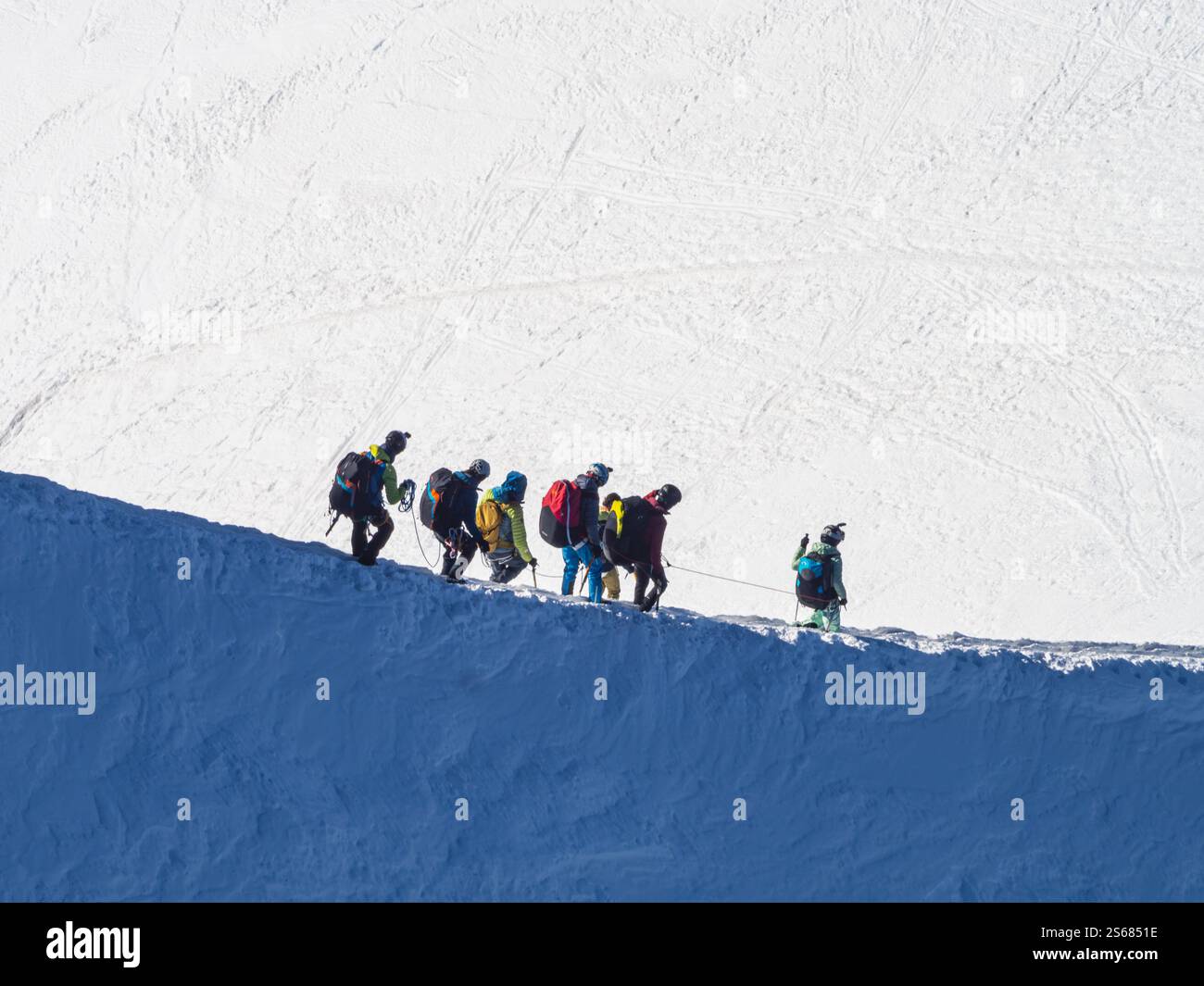 Paragliders with large backpacks with a parachute inside descend a ...