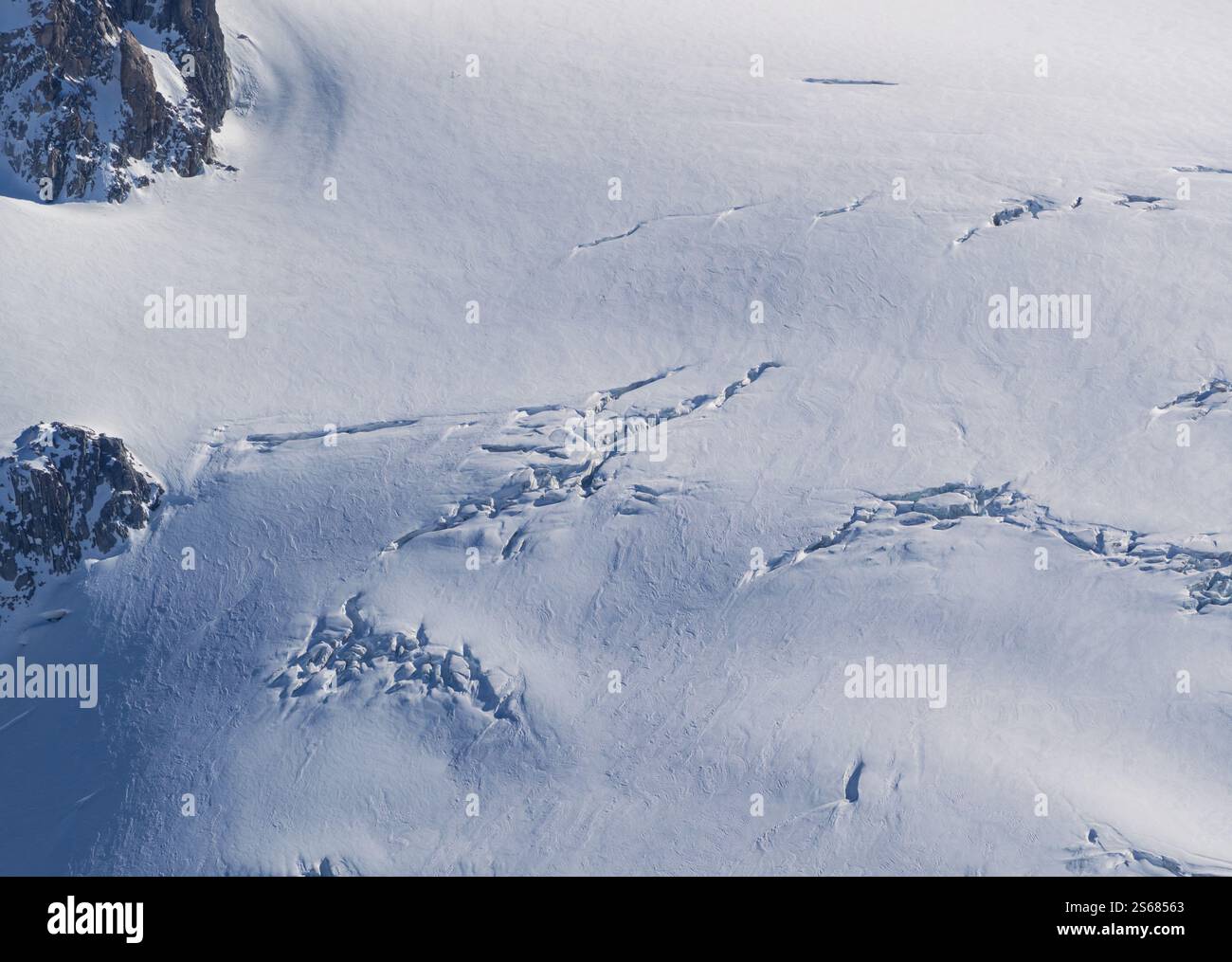 An aerial view of intricate snow formations in the French Alps. The ...