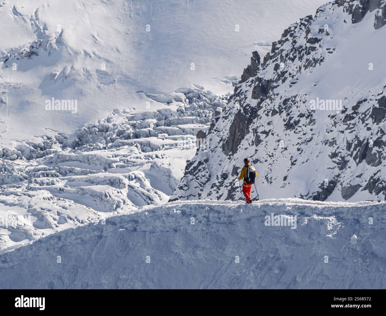 Paragliders with large backpacks with a parachute inside descend a ...