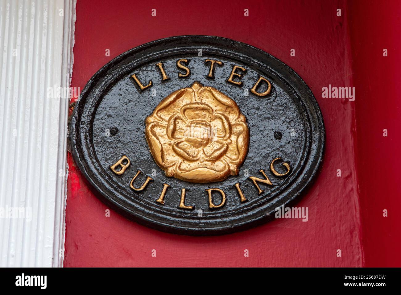 Close-up of a Listed Building plaque on a building in Coggleshall ...