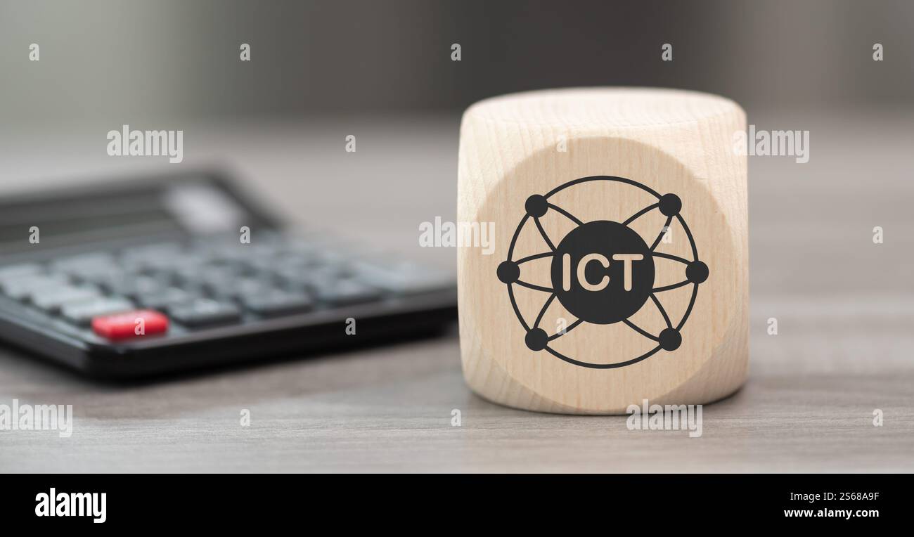 Wooden block with symbol of ict concept and calculator on background ...