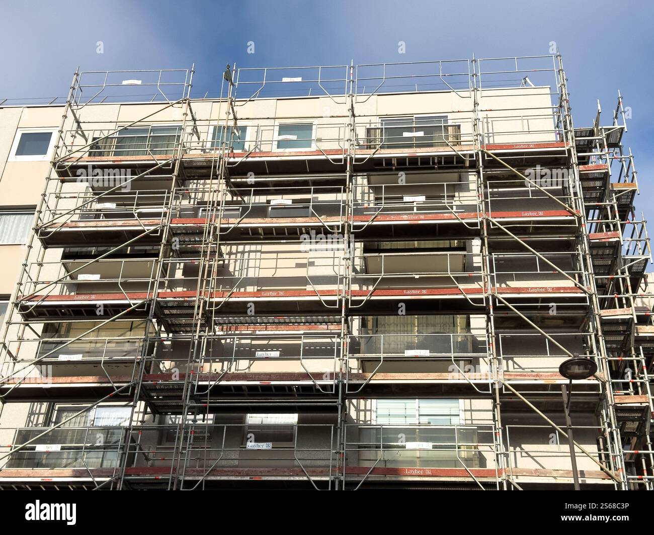 Scaffolding around a residential building during renovation work Stock ...