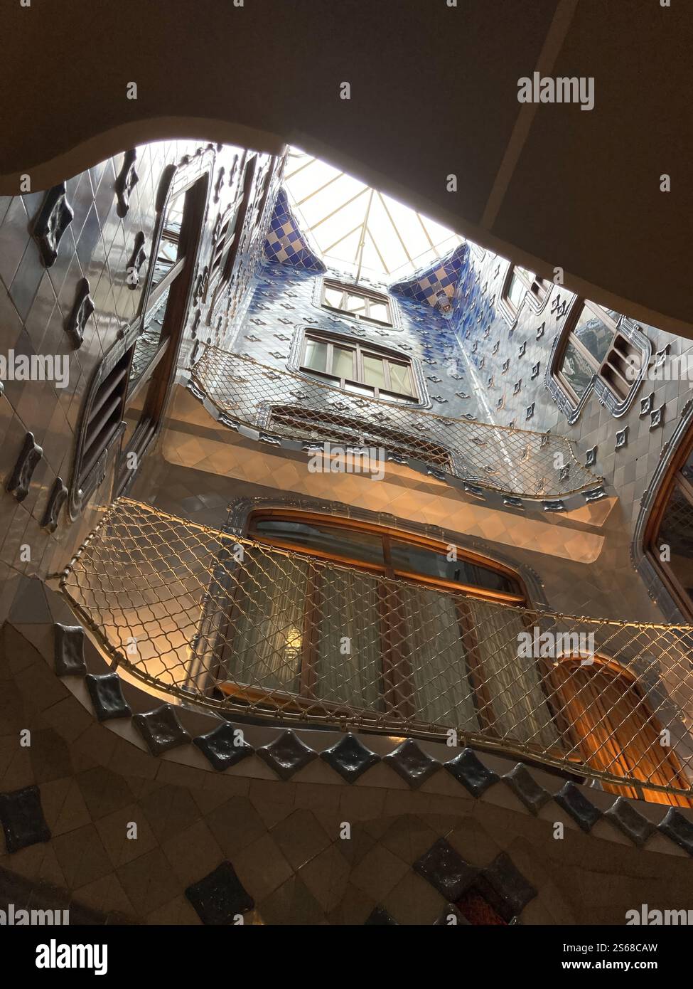 View of the blue and white tiles central light well of Casa Batlló in ...