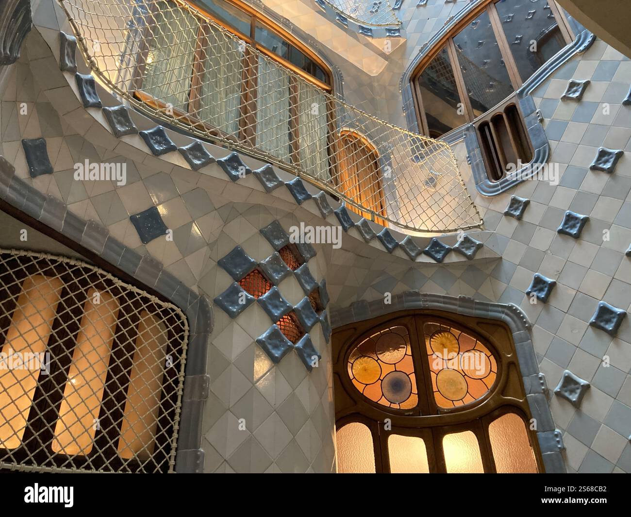 View of the blue and white tiles central light well of Casa Batlló in ...