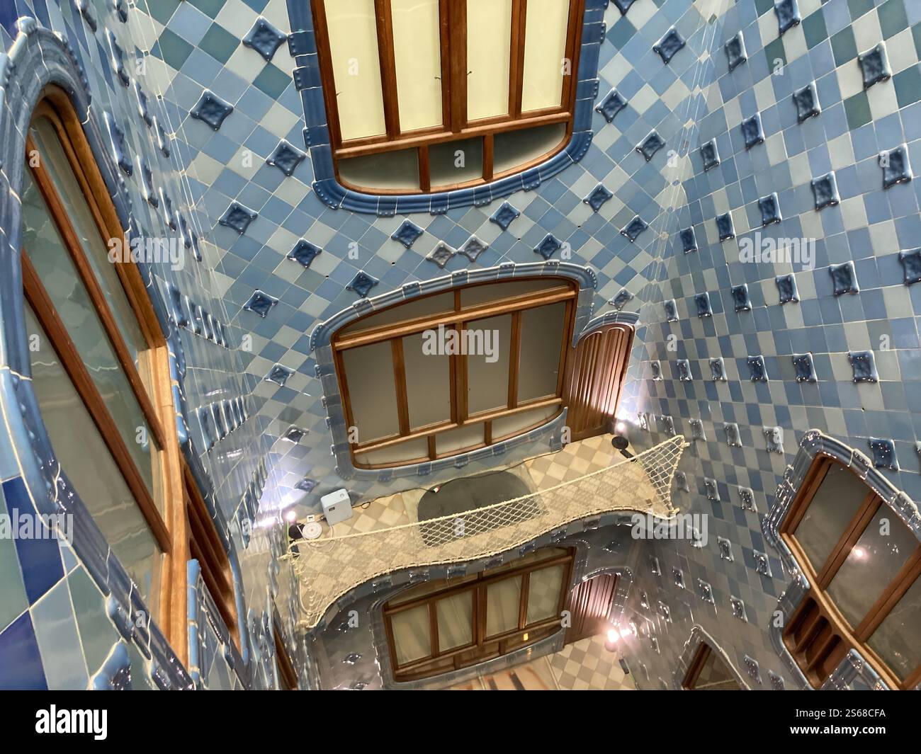 View of the blue and white tiles central light well of Casa Batlló in ...