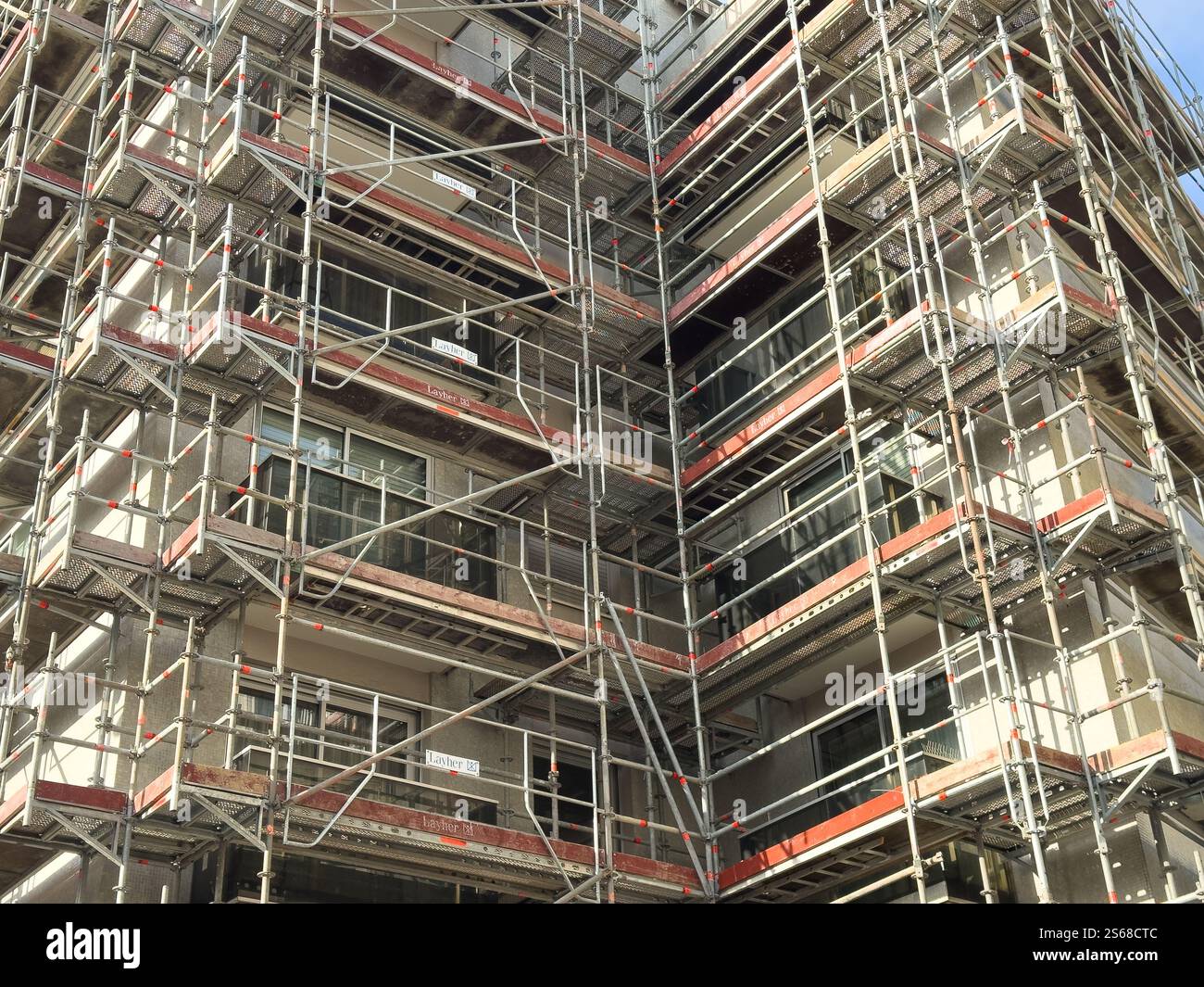 Scaffolding around a residential building under construction Stock ...