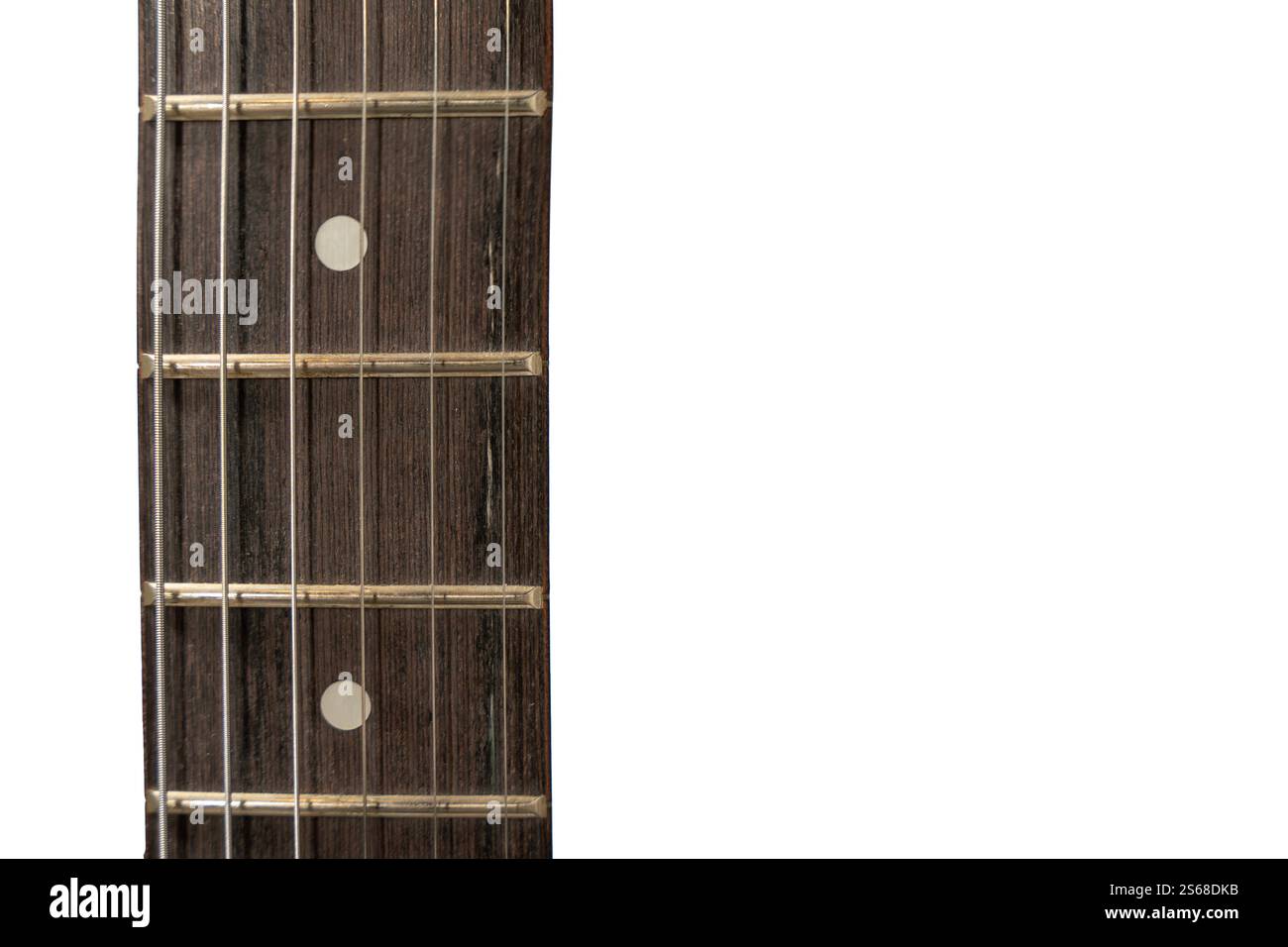 A close up of a guitar neck with a white background. The neck is made ...