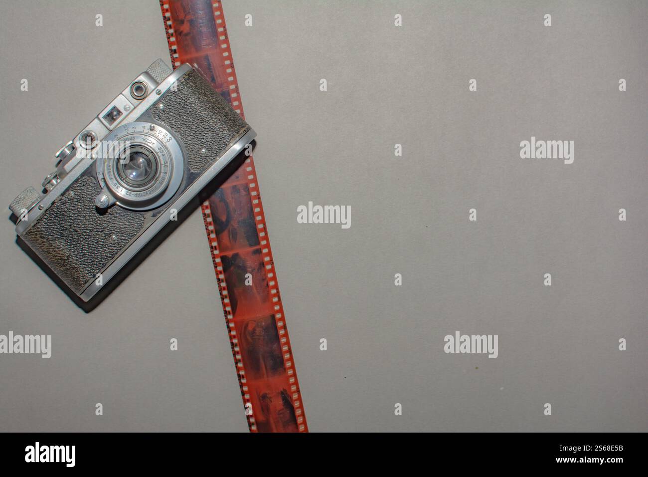 A camera with a metal body and a lens. Old cameras. Antiques technology ...