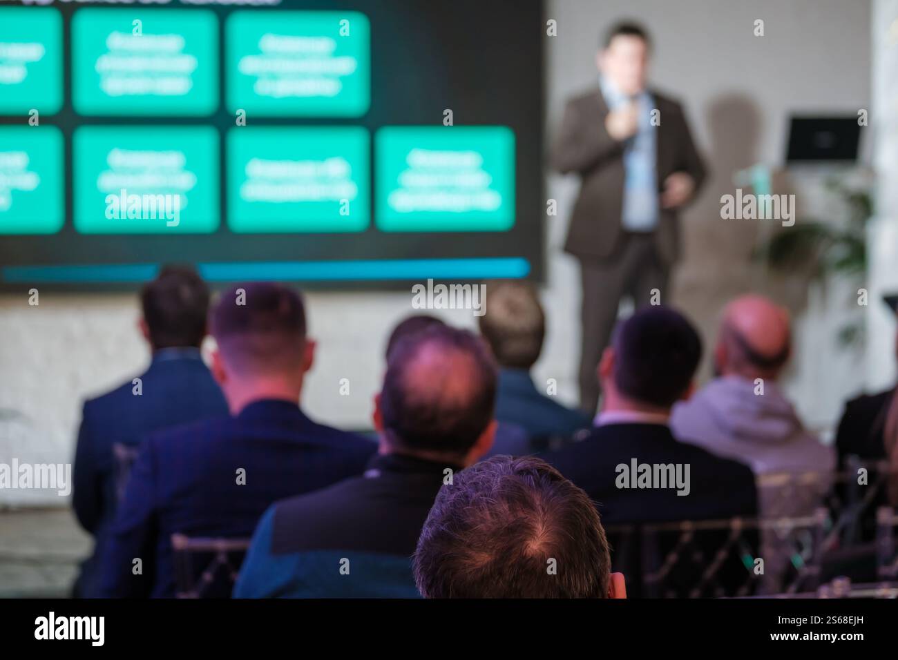 Audience members listening to speaker during professional business ...