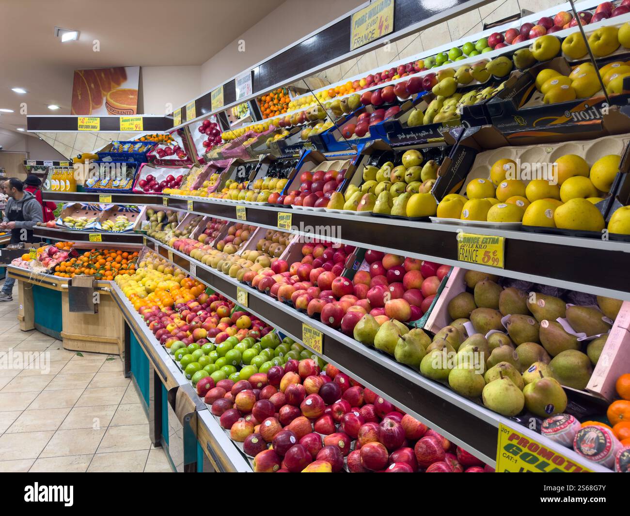 Colorful display of fresh fruits in a grocery store during daytime ...