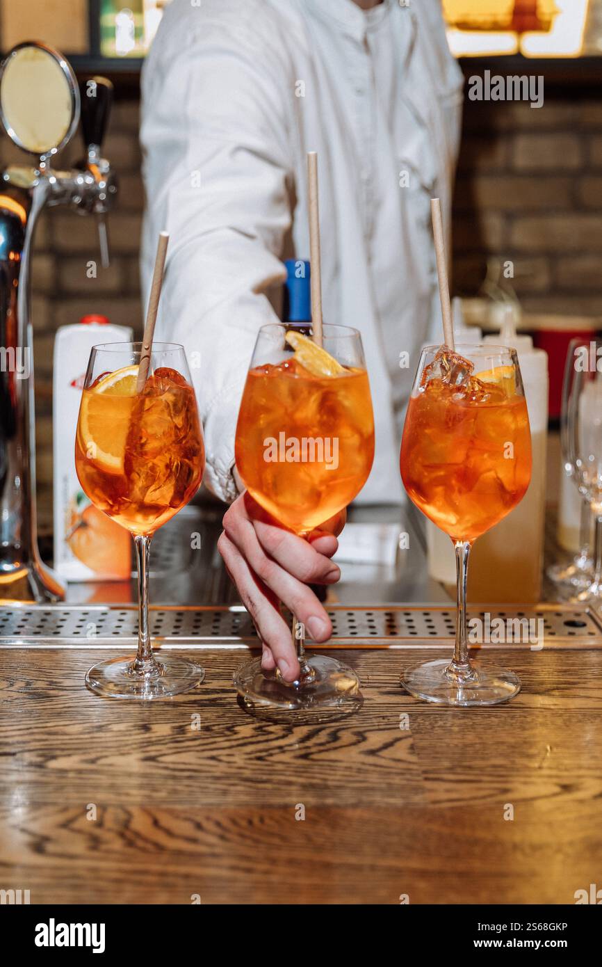 Refreshing Aperol spritz cocktails served at a bar, perfect for ...