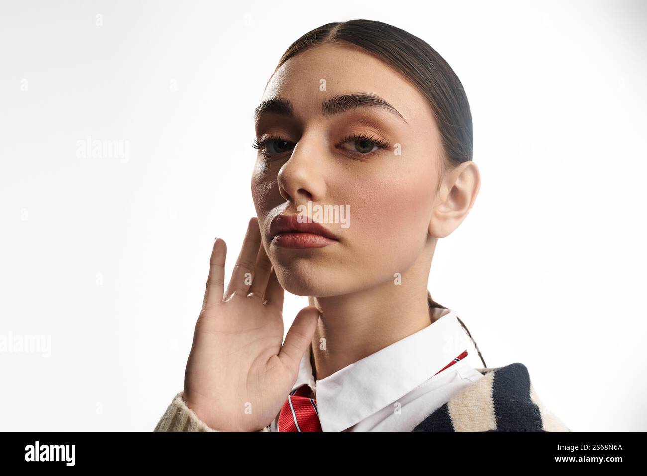 Beautiful young woman with striking features shows emotion in an ...