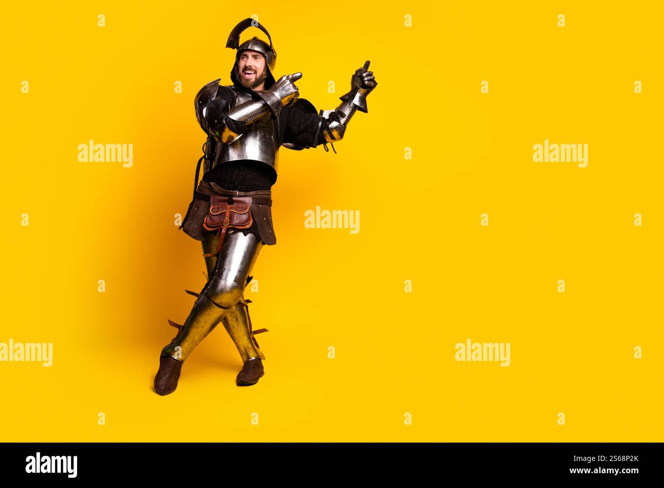 A cheerful knight in shining armor posing with a bright yellow ...