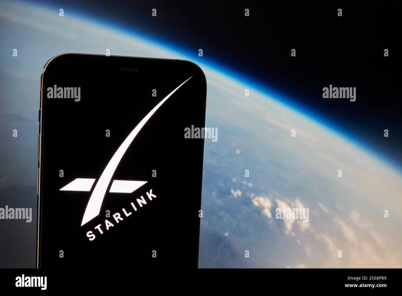 iPhone Displaying Starlink Logo with Earth's Stratosphere as Background ...