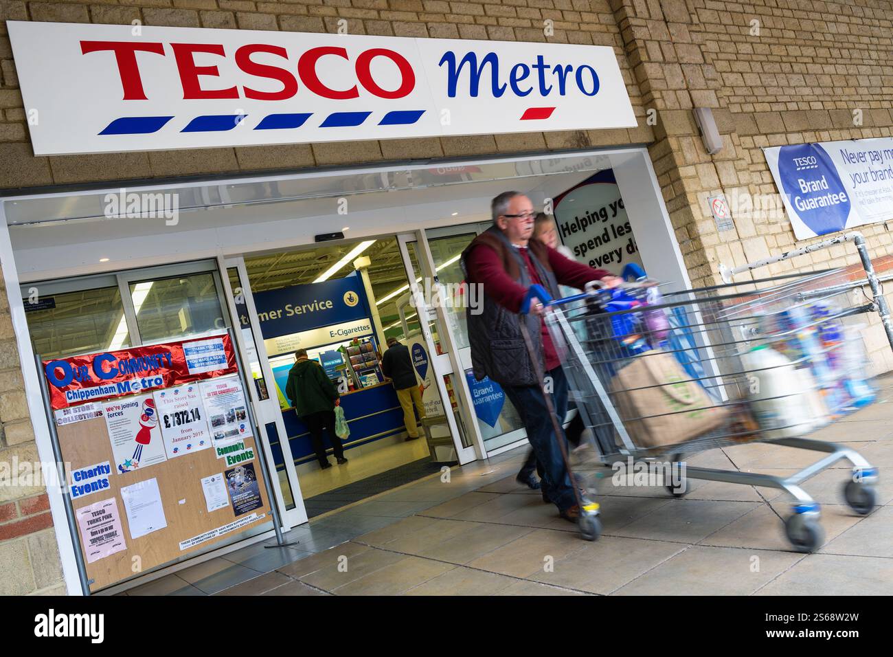 A shopper having finished their shopping is pictured walking out of the ...