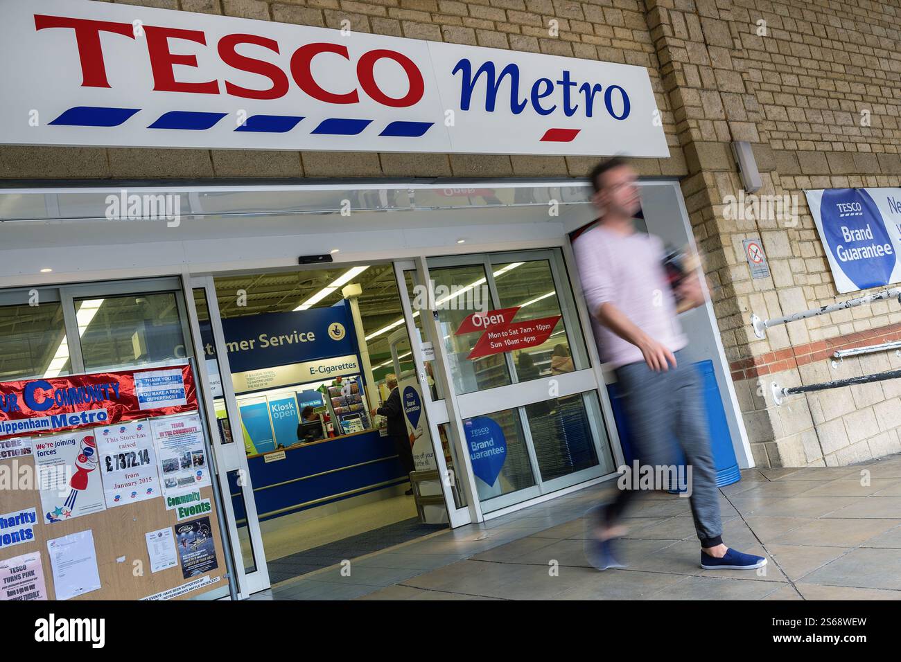 A shopper having finished their shopping is pictured walking out of the ...