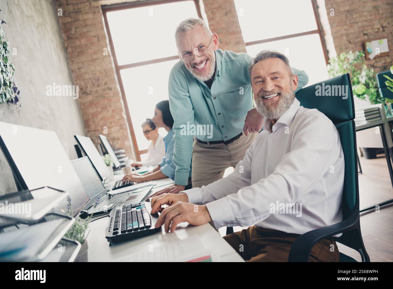 Photo of teamwork people together cheerful senior men work computer ...