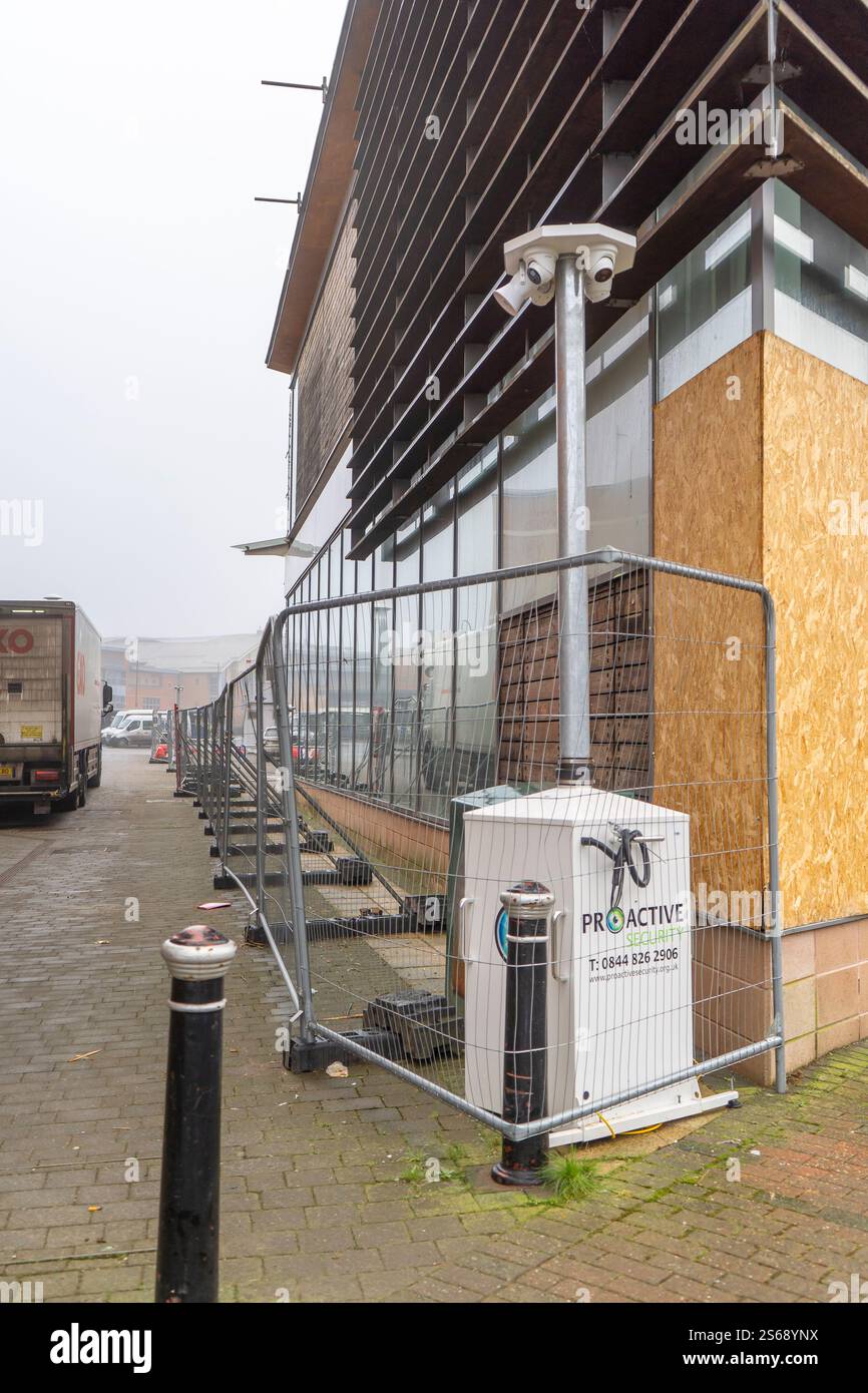 A proactive portable camera security system installed behind security ...