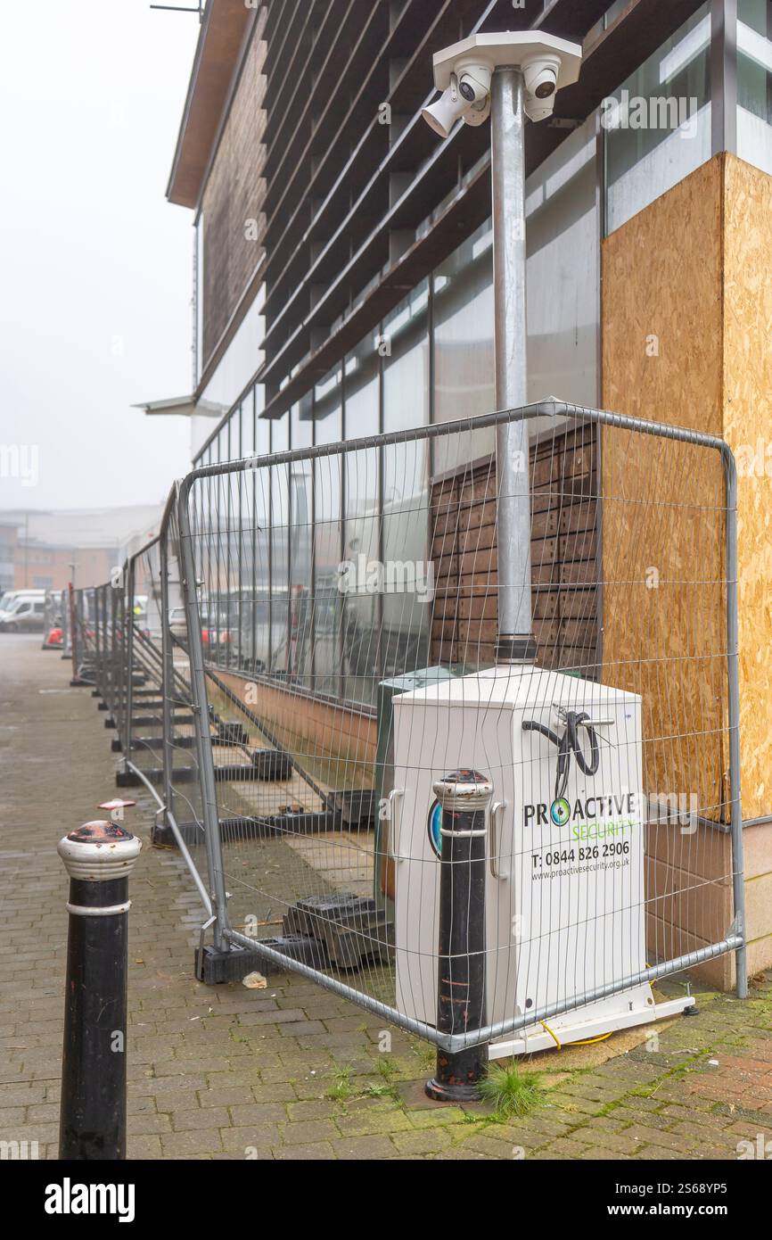 A proactive portable camera security system installed behind security ...