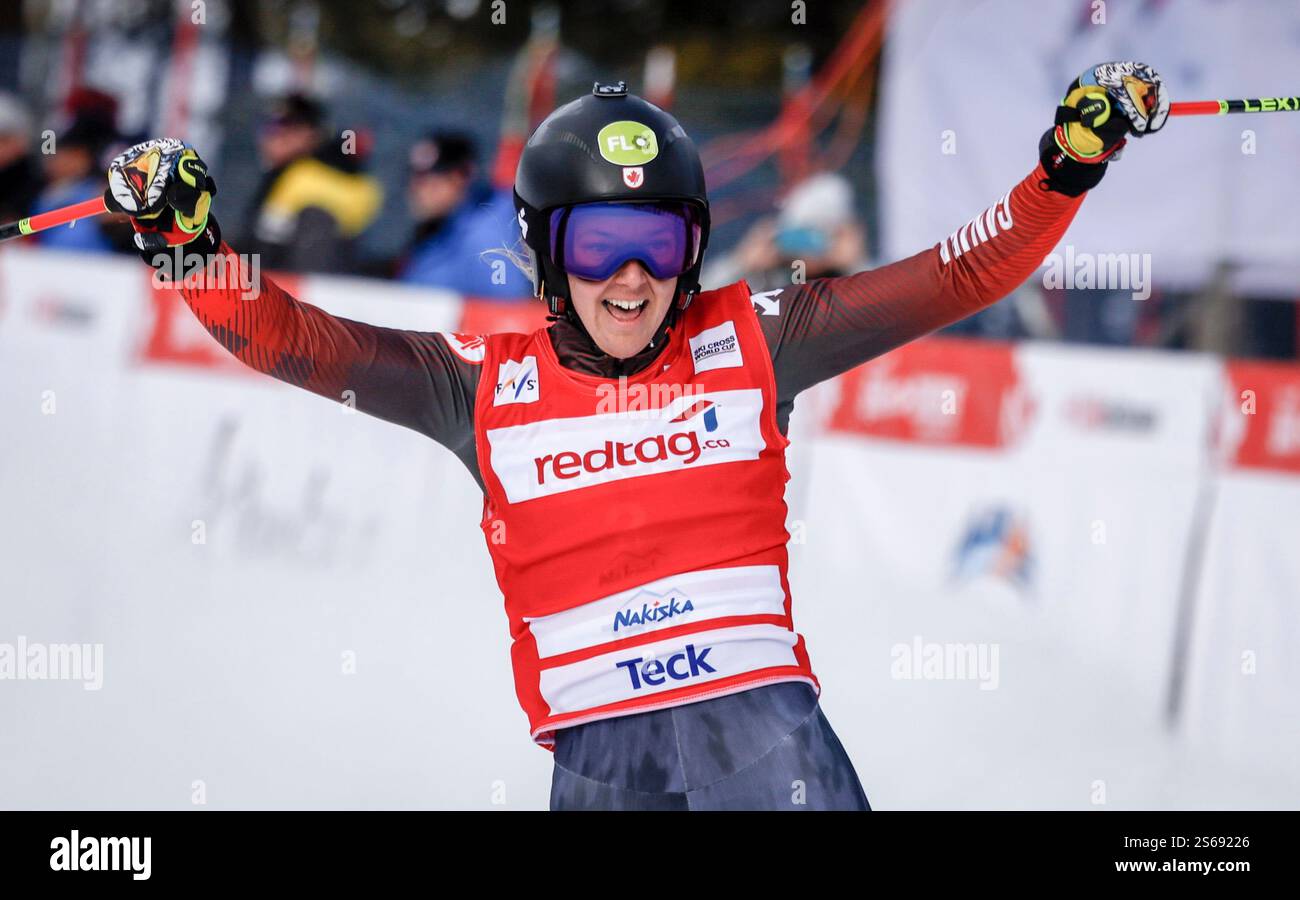 Canada's Hannah Schmidt celebrates her win as she crosses the finish ...