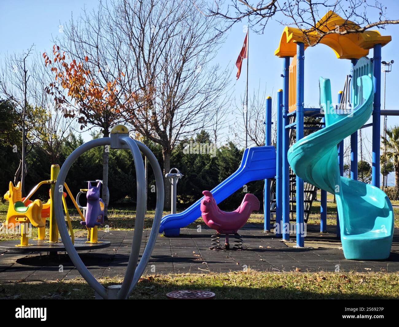 Colorful outdoor children's playground arena with a springy rider ...