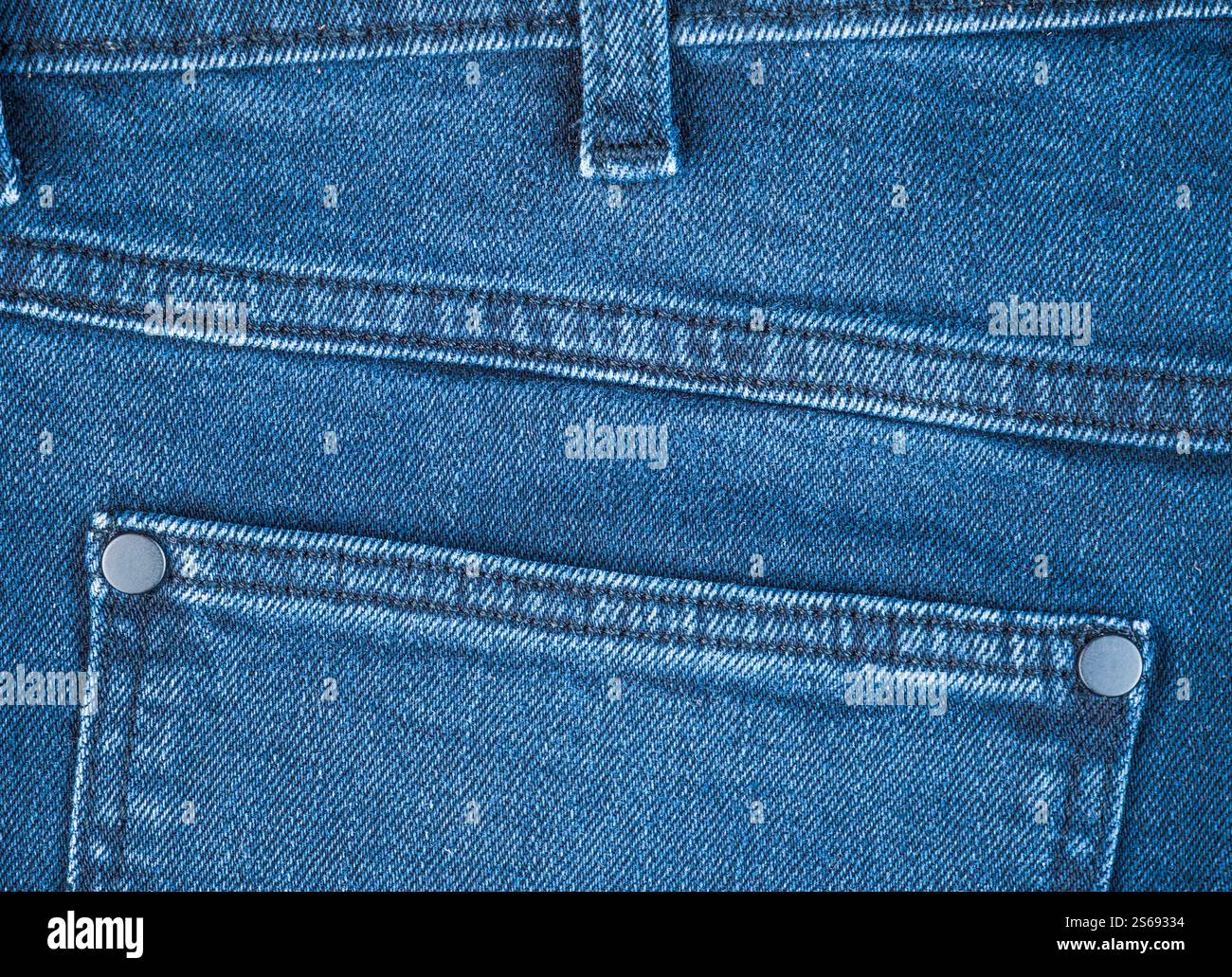 textured surface of blue denim with a rear pocket design Stock Photo ...