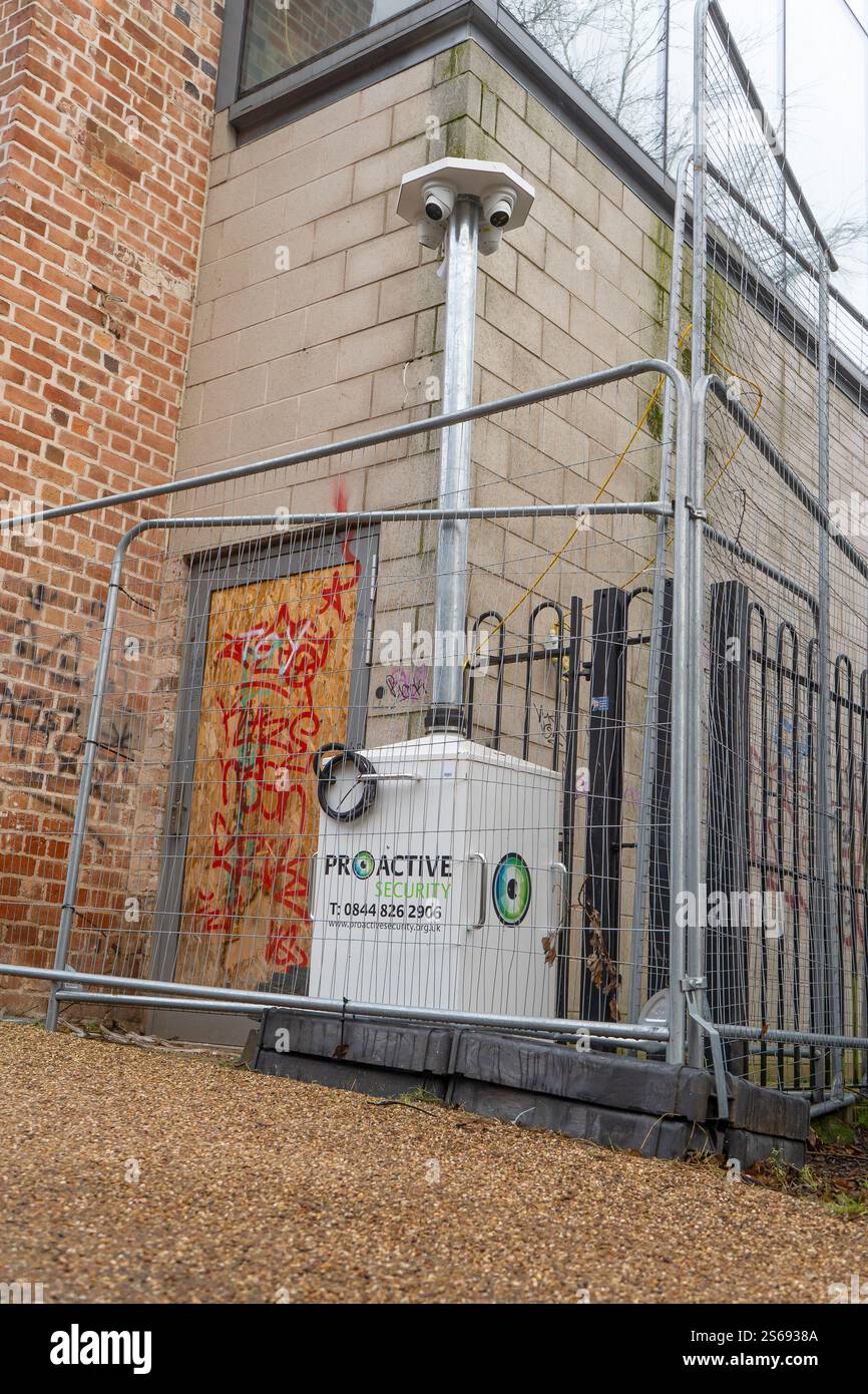 A proactive portable camera security system installed behind security ...