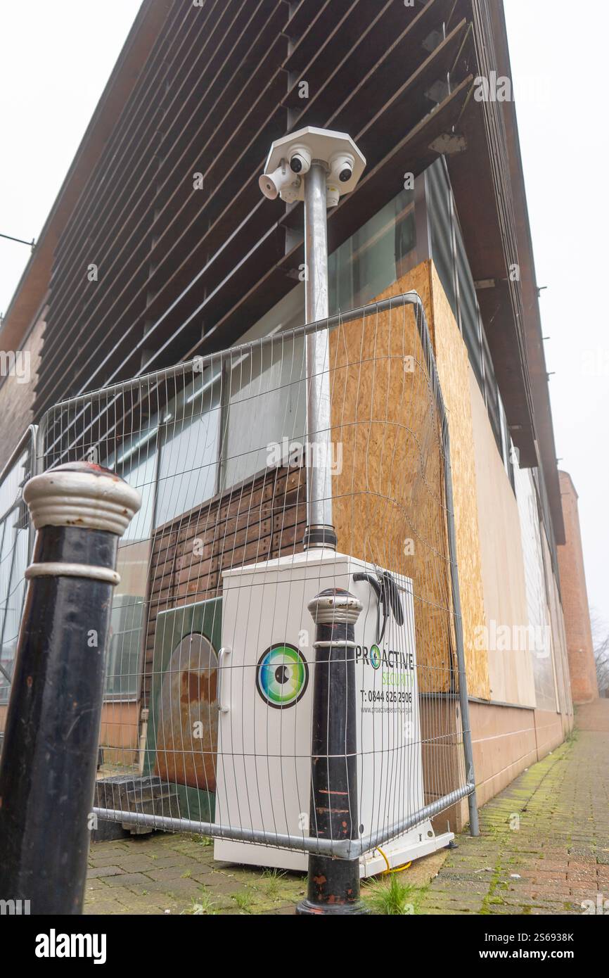 A proactive portable camera security system installed behind security ...