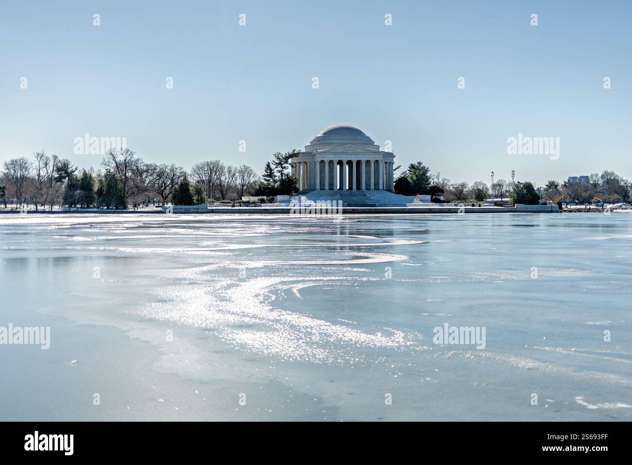 WASHINGTON DC — The Jefferson Memorial reflects on the partially frozen ...