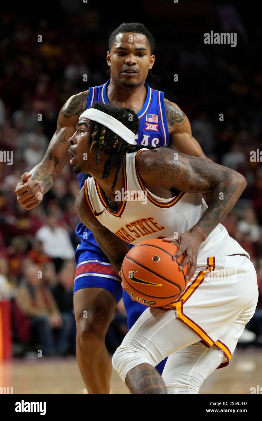 Iowa State guard Keshon Gilbert drives past Kansas guard Shakeel Moore ...
