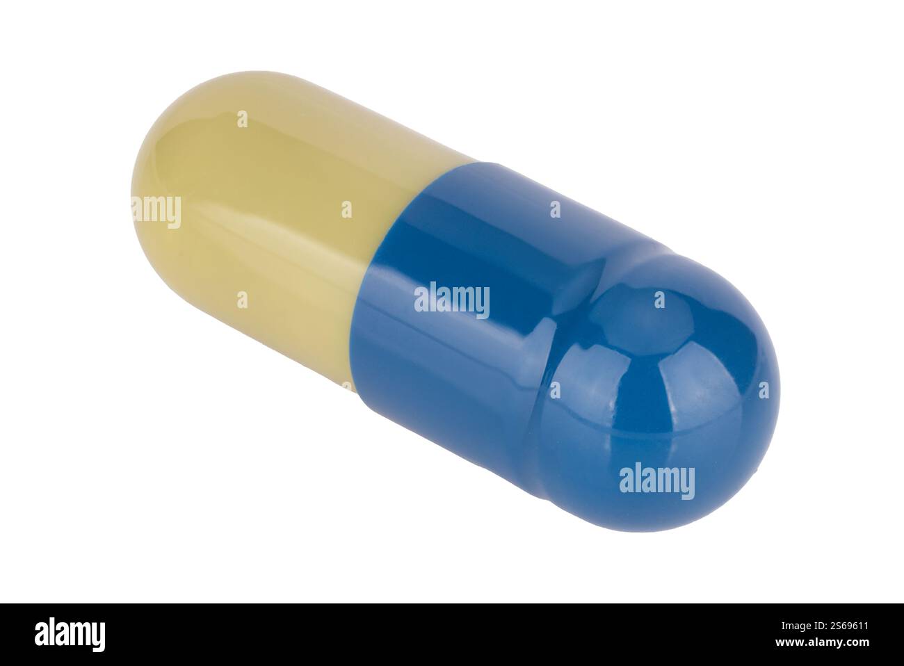 Single closed medical capsule in blue and green Stock Photo - Alamy