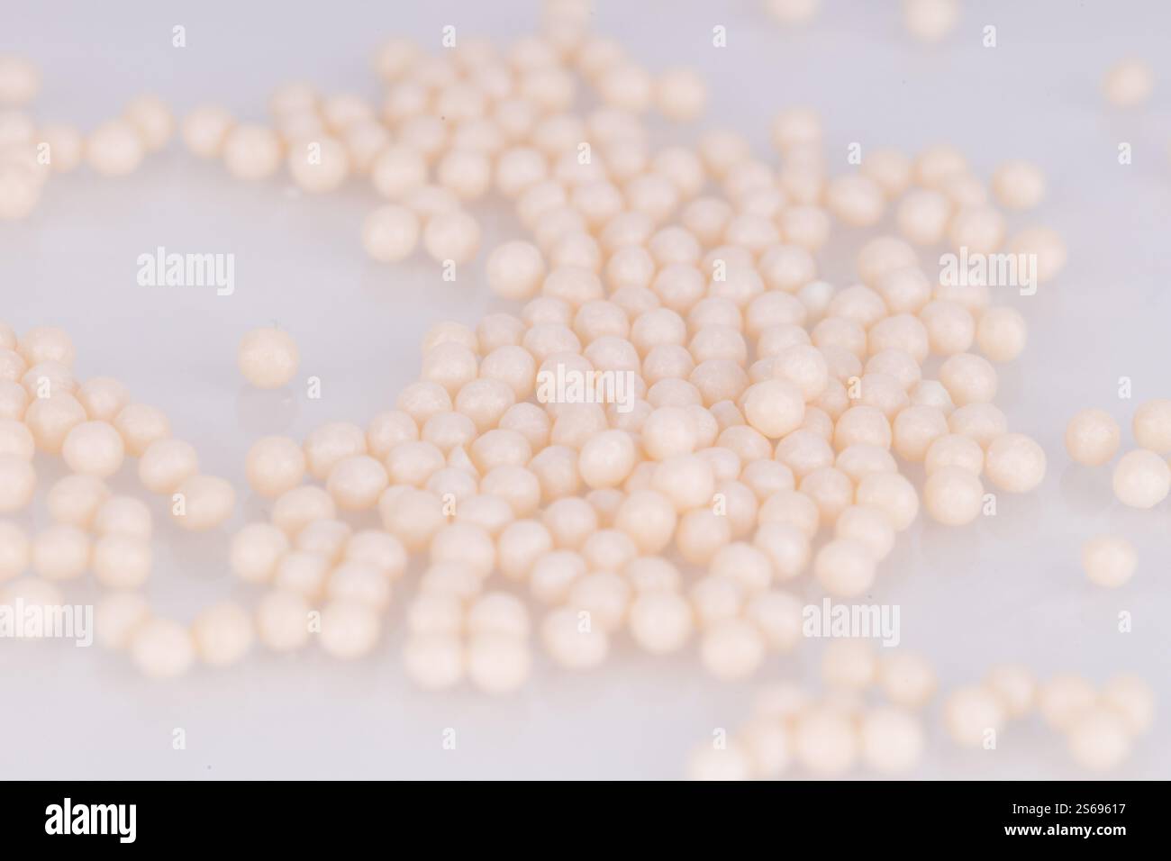 Scattered medical mini granules on a smooth surface Stock Photo - Alamy