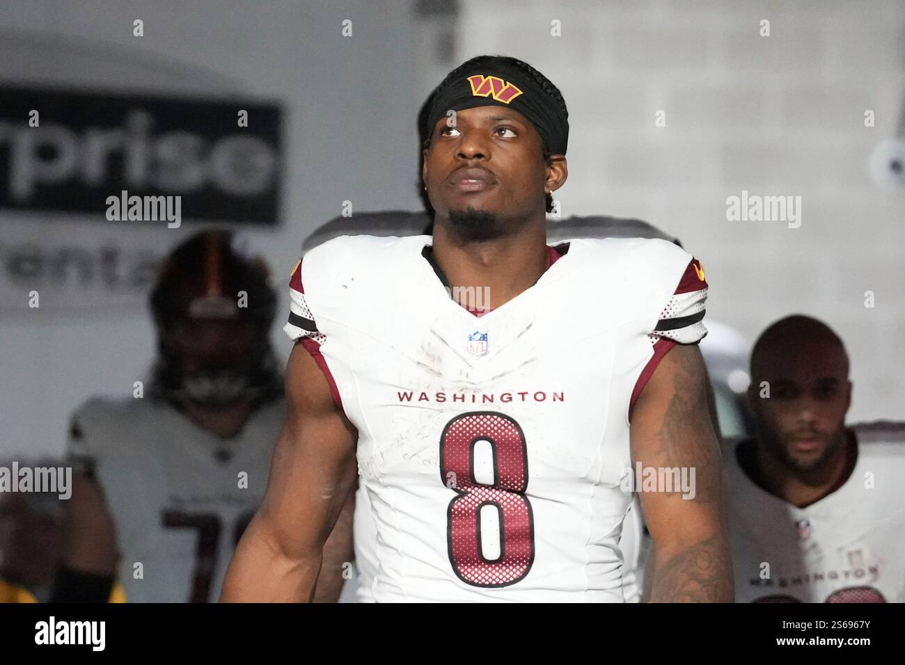 Washington Commanders running back Brian Robinson Jr. (8) enters the field after half time an ...
