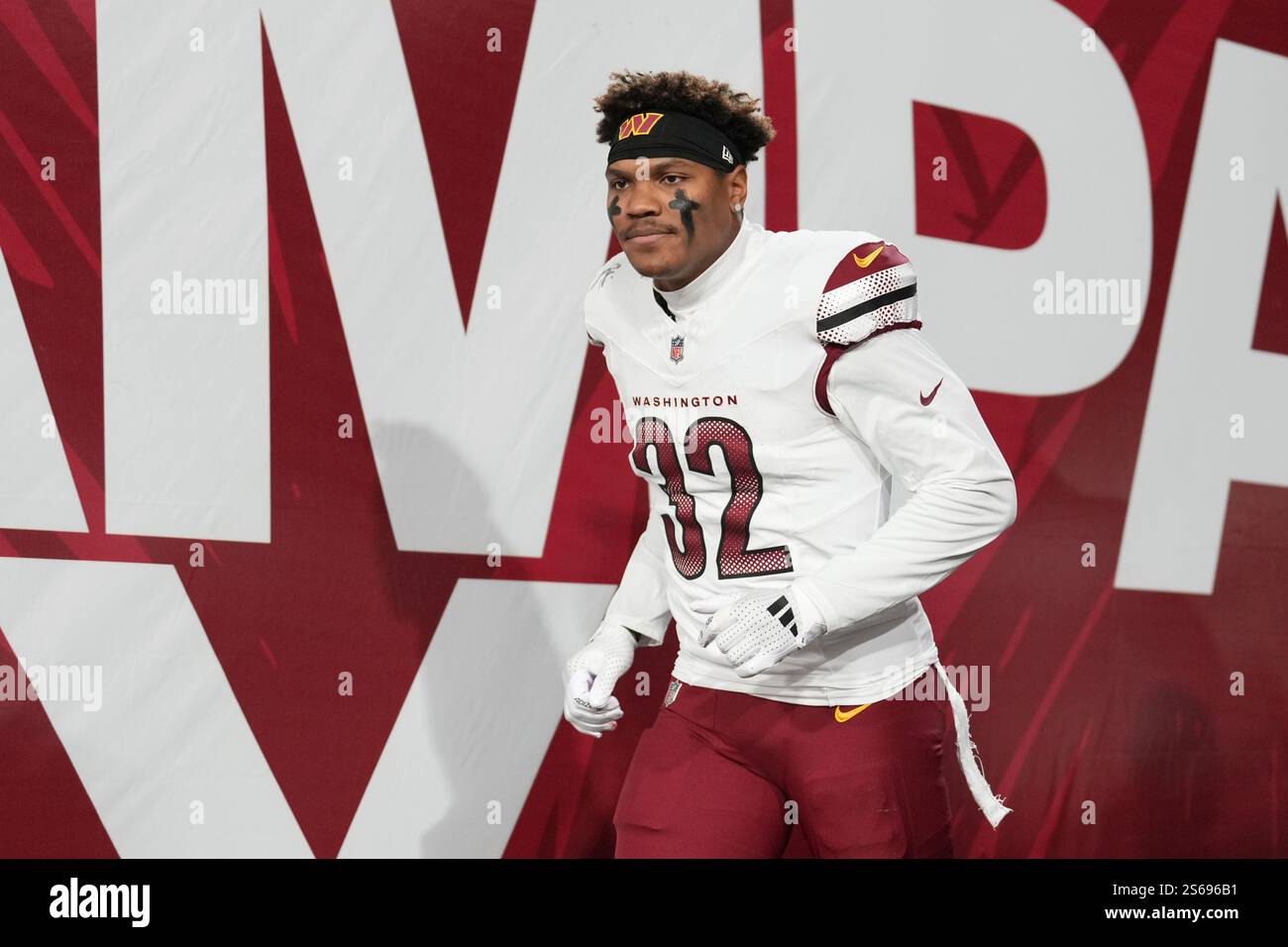 Washington Commanders linebacker Mykal Walker (32) enters the field ...
