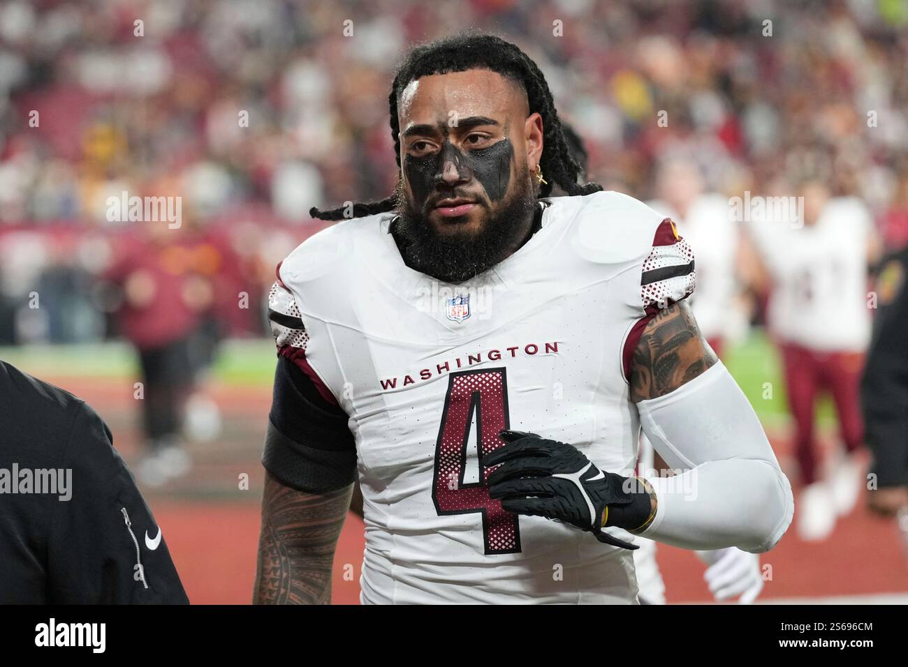 Washington Commanders linebacker Frankie Luvu (4) leaves the field ...