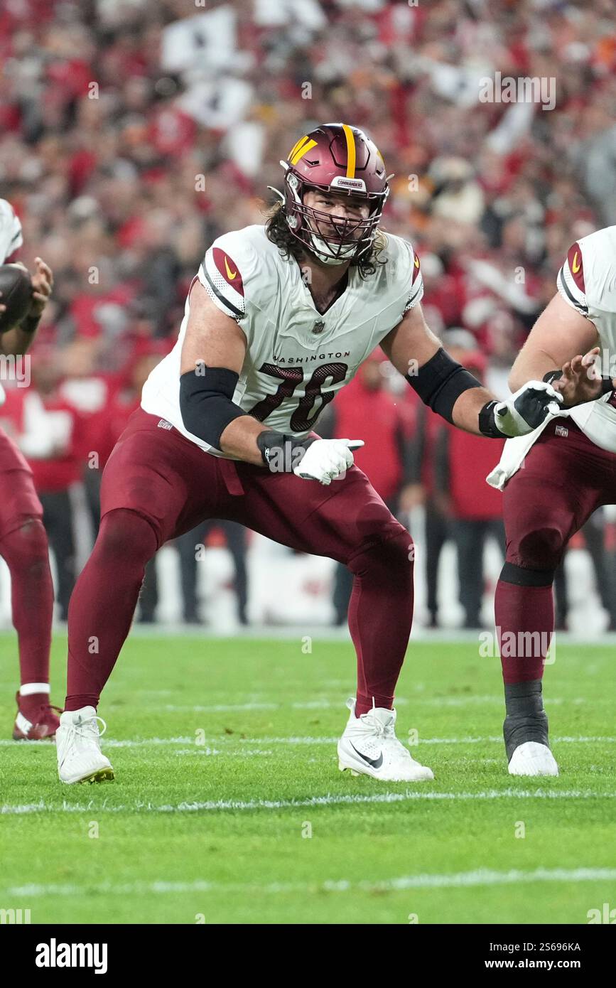 Washington Commanders guard Sam Cosmi (76) protects he pocket during an ...