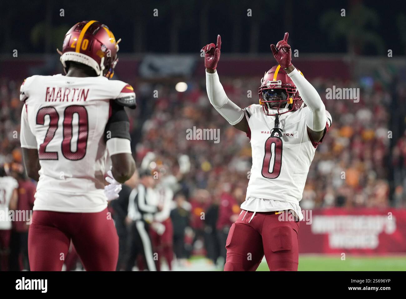 Washington Commanders cornerback Mike Sainristil (0) celebrates a ...