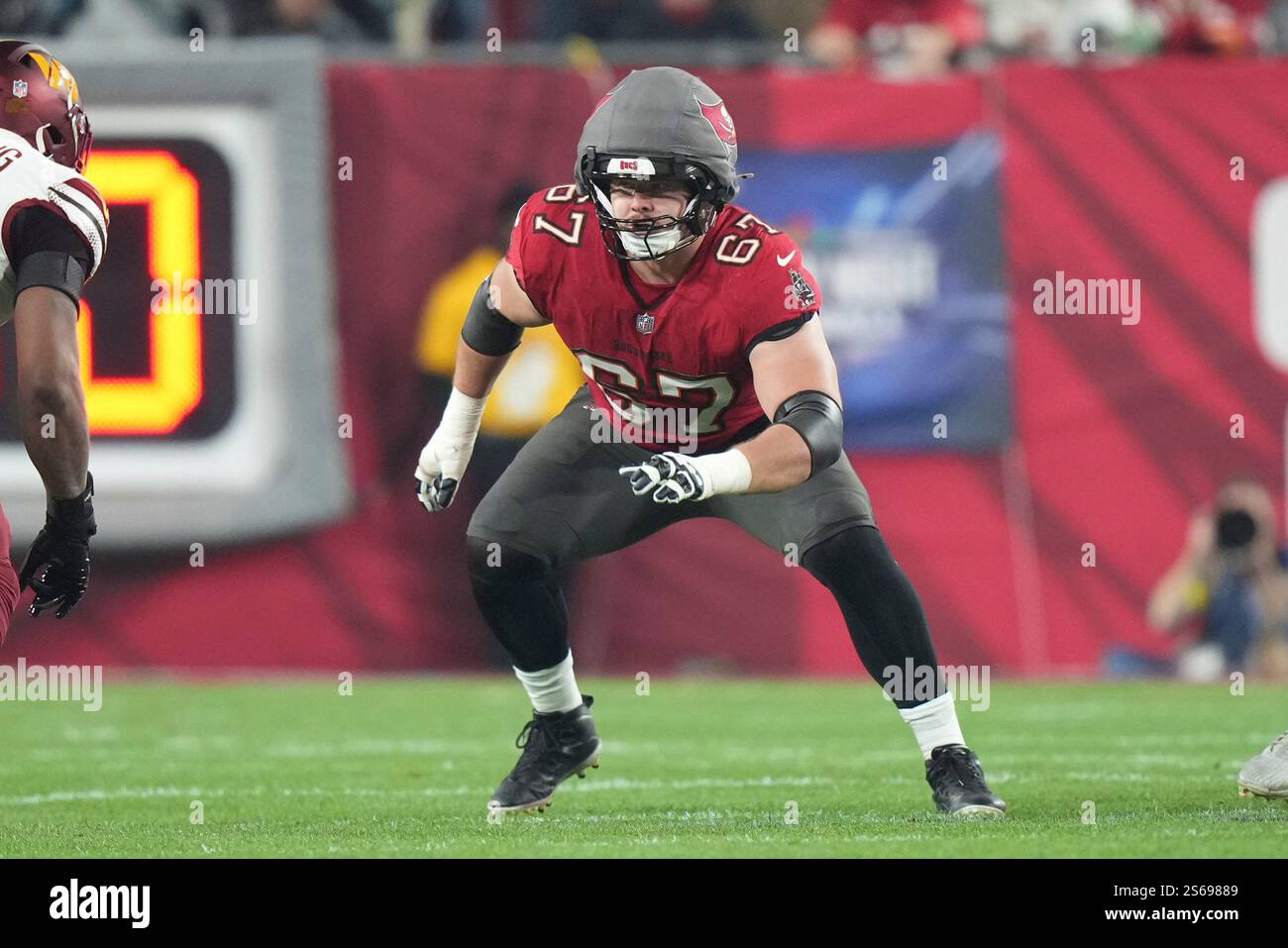 Tampa Bay Buccaneers offensive tackle Luke Goedeke (67) run blocks ...
