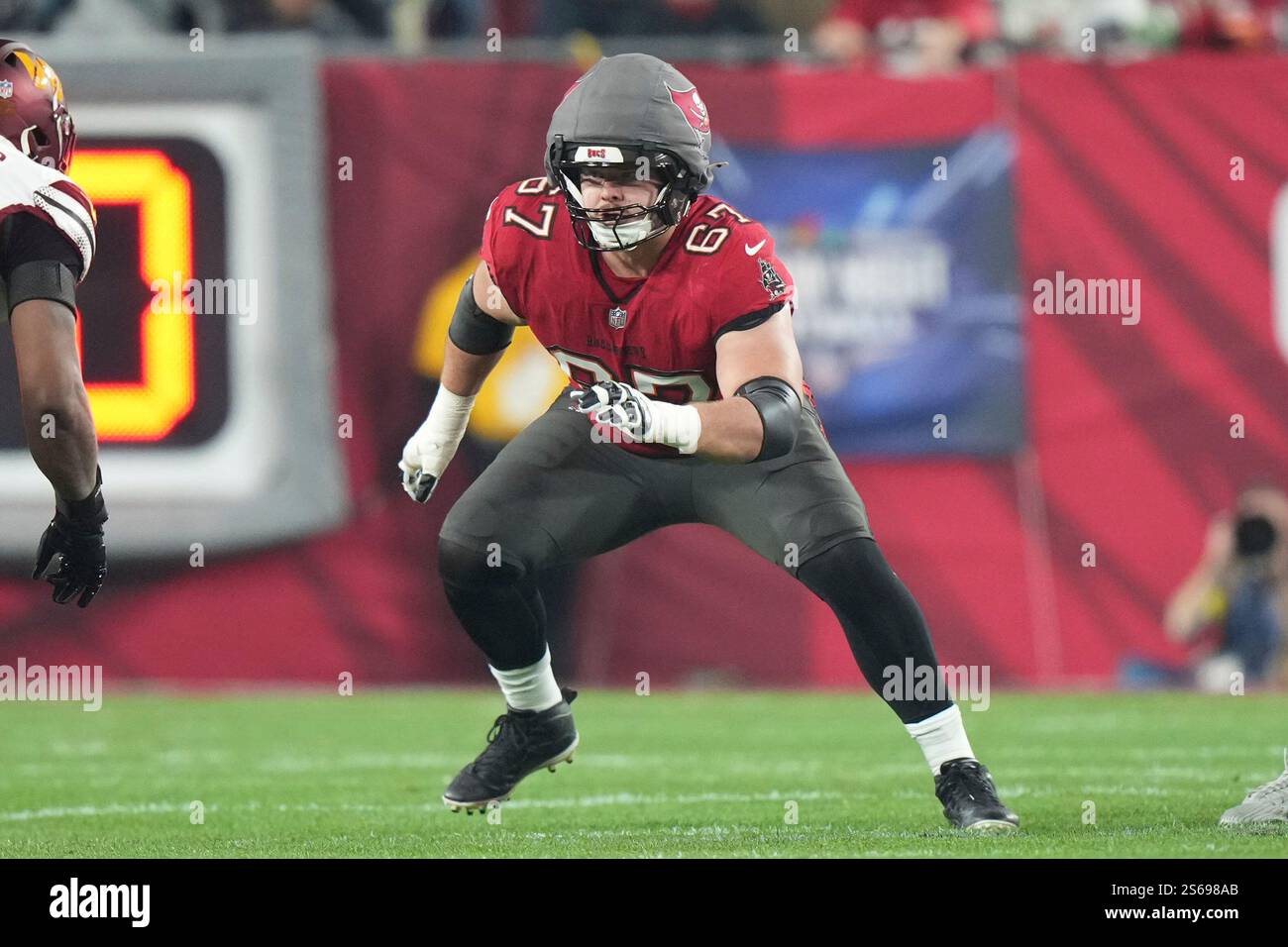Tampa Bay Buccaneers offensive tackle Luke Goedeke (67) run blocks ...