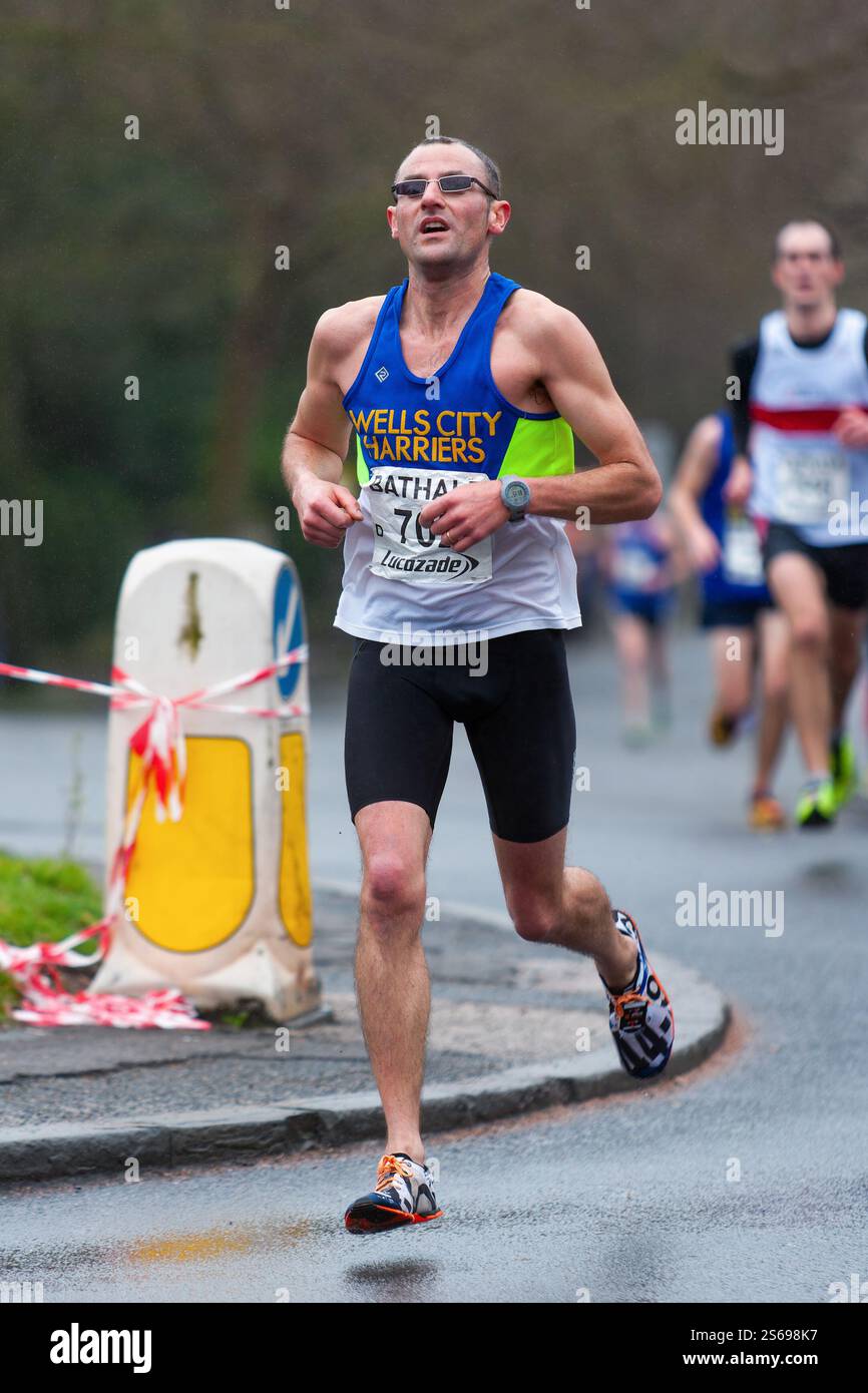 Male athletes running and competing in the Bath Half Marathon road race ...