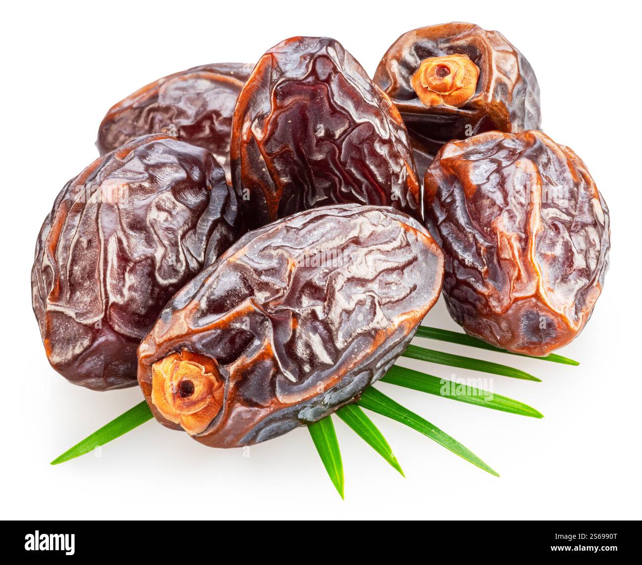 Semi-dried dates or date palm fruits lie on palm leaves isolated on ...