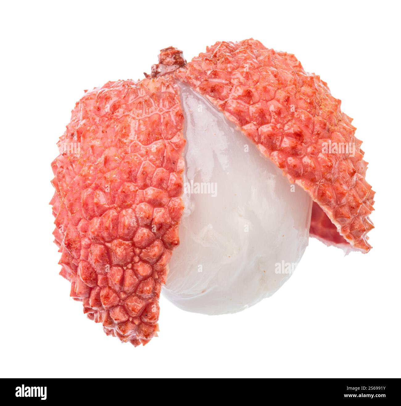 Lychee fruit with partially peeled away textured red skin, revealing ...