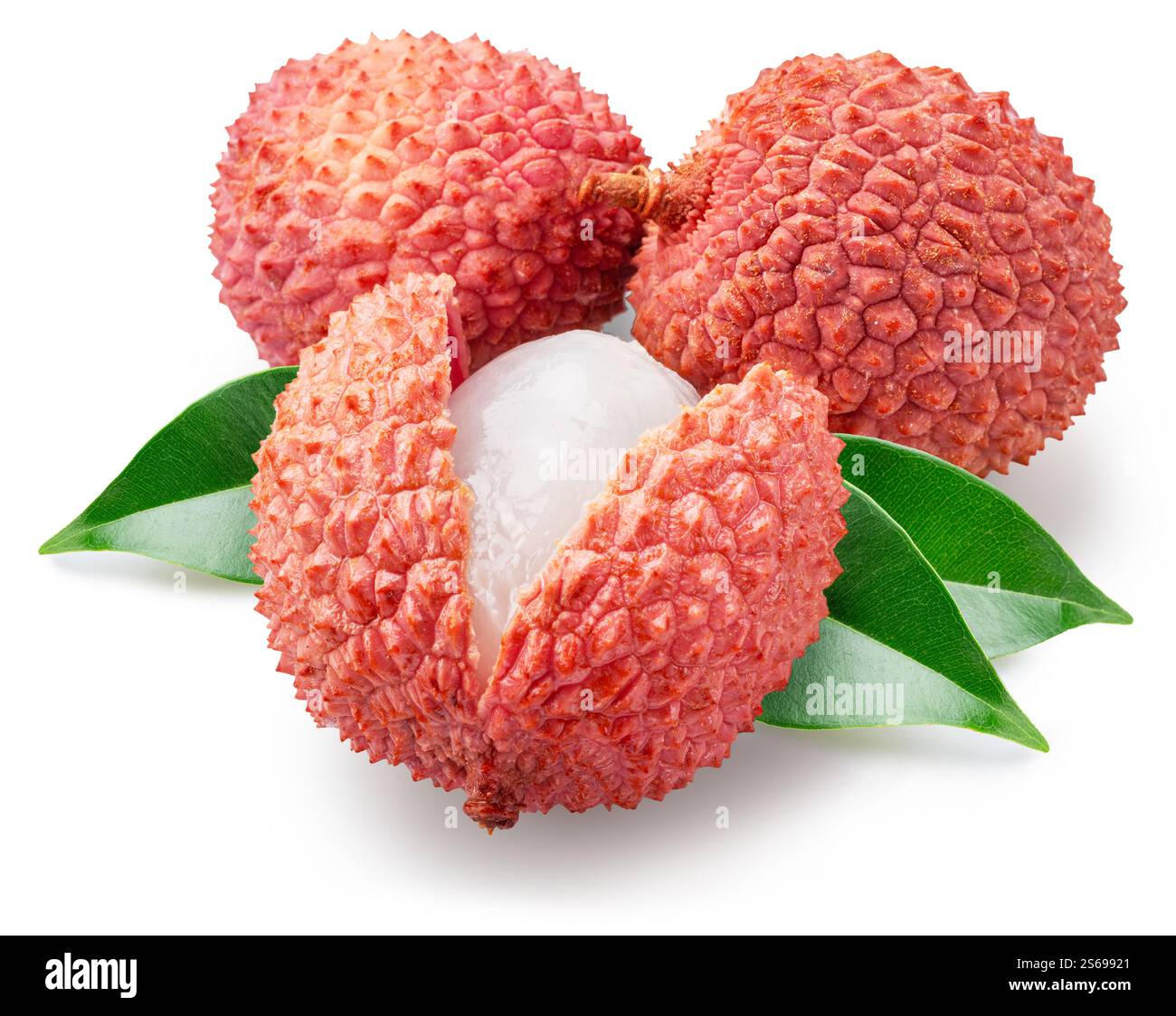 Lychee fruits with green leaves and one lychee peeled in half isolated ...